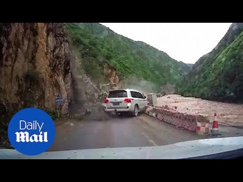 Terrifying rockslide almost crushes car on narrow mountain road - YouTube