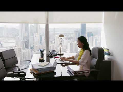 Business woman secretary typing fast on laptop in office
