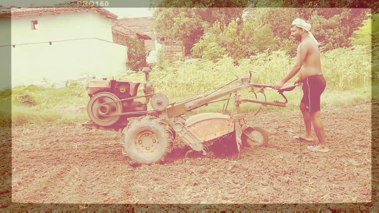 How to plough by power tiller - YouTube