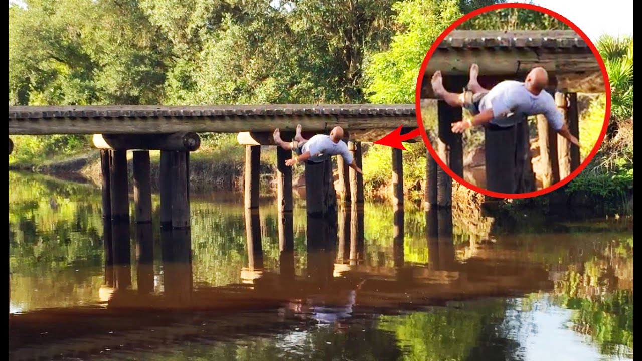 Redneck jumps off bridge and does back flop - YouTube