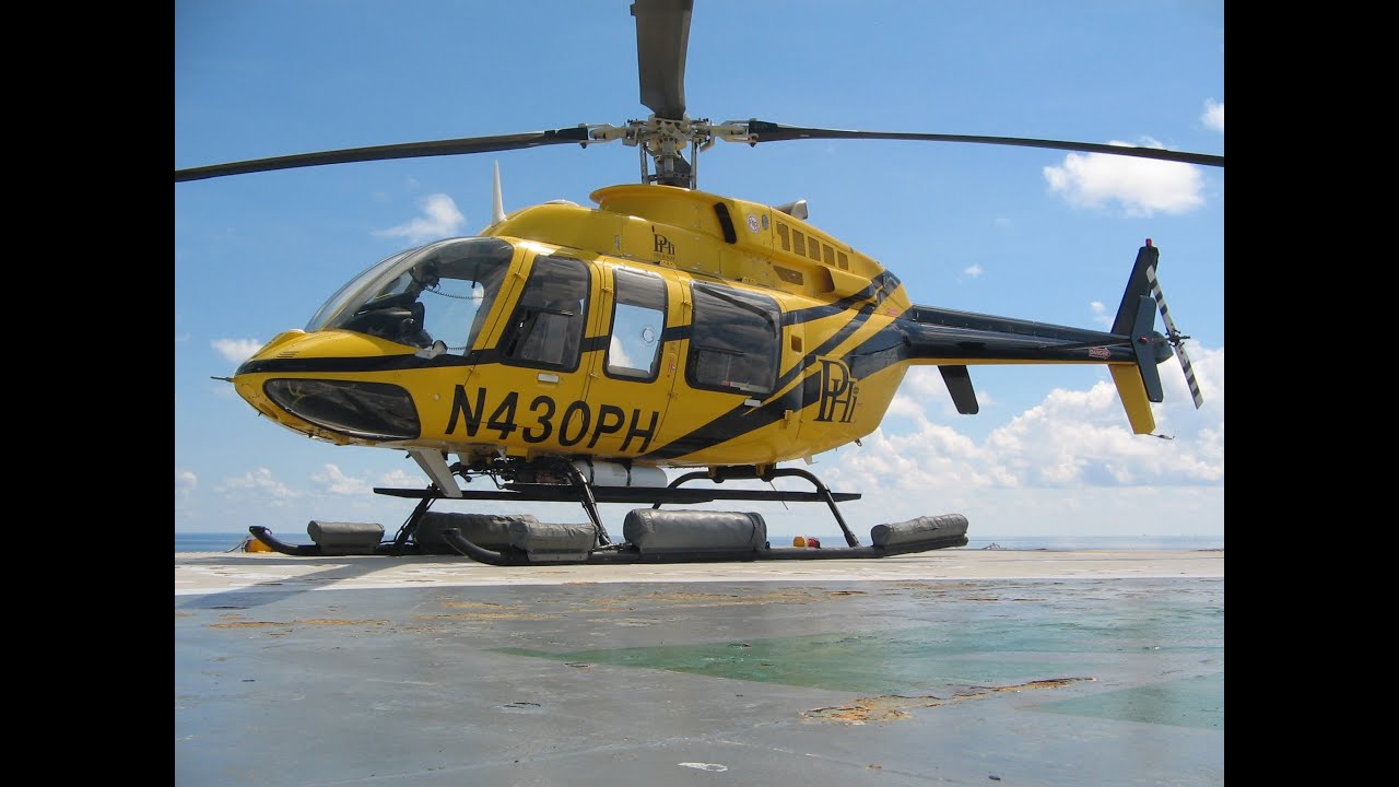 Helicopter approaching offshore drilling rig - YouTube