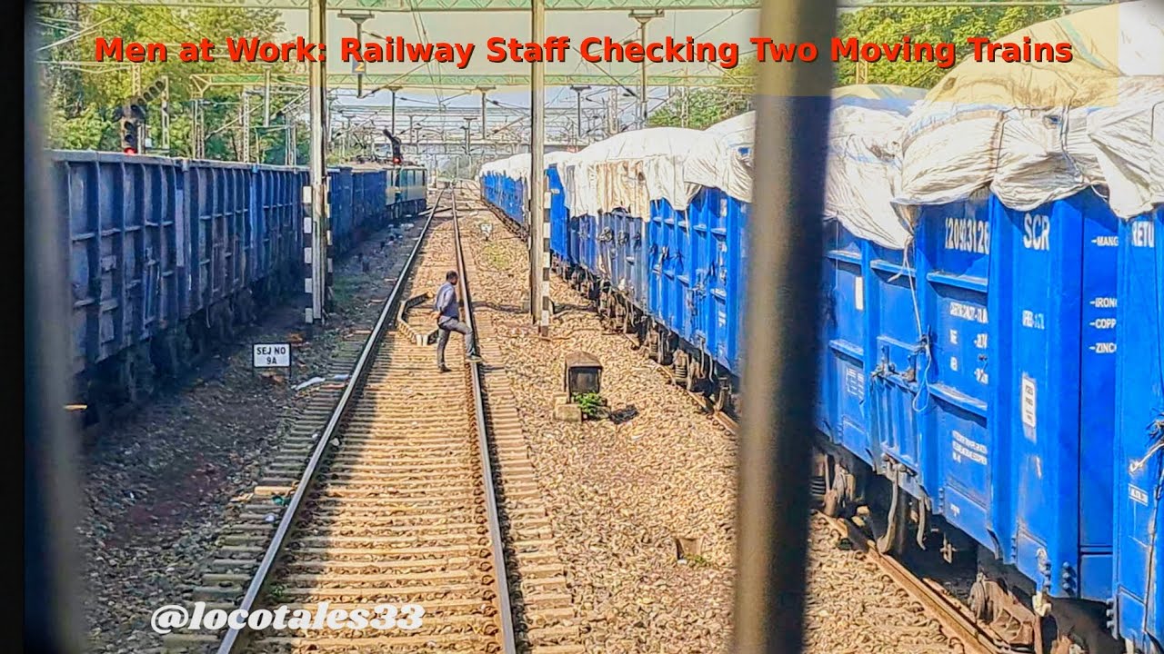 Railway staff at work: in between two moving goods Trains #railway # ...