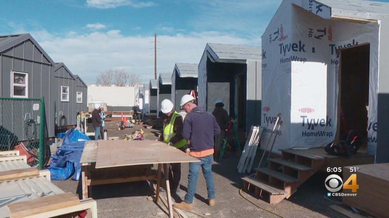 Volunteers Help Build Tiny Homes For Homeless - YouTube