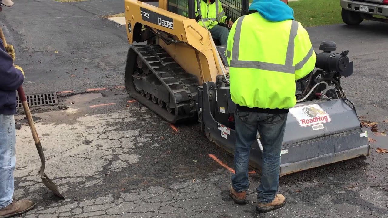 RoadHog RH4060 milling distressed pavement. - YouTube