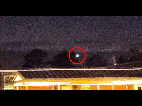 Pulsating UFO lands behind school caught on camera