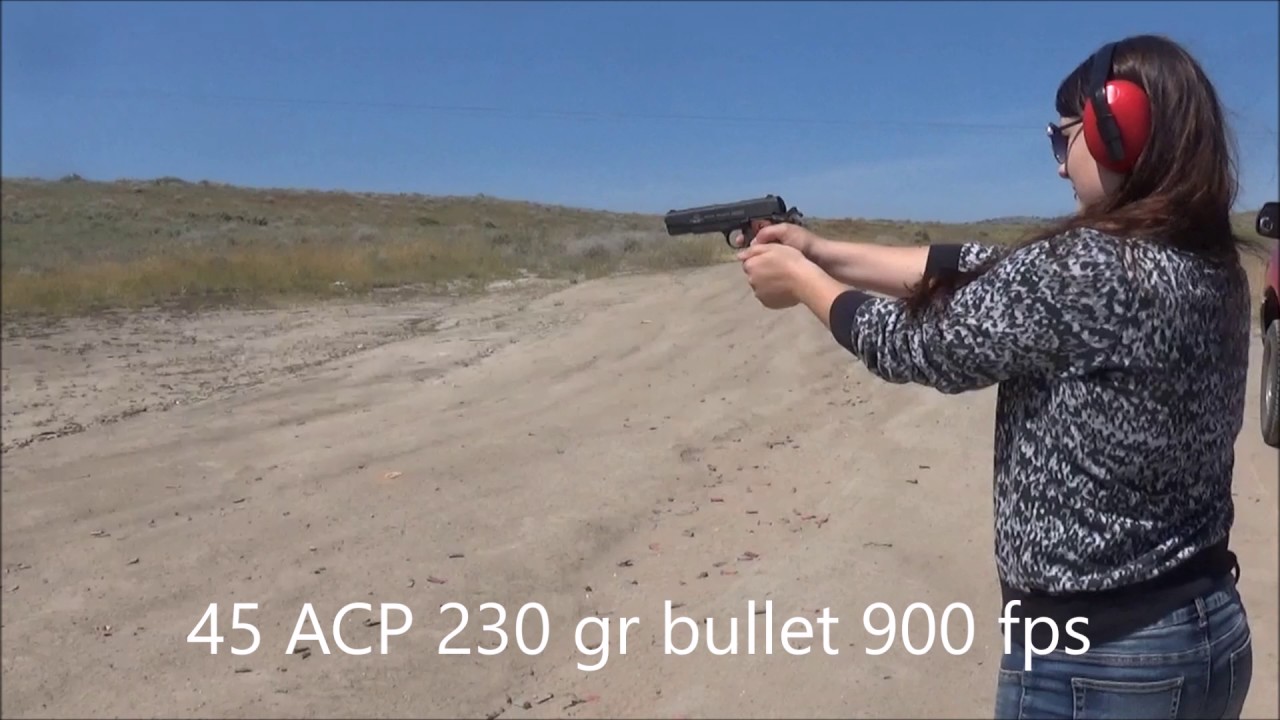 Montana Mountain Woman firing the 45 ACP 1911 and 45 Colt peacemaker in ...
