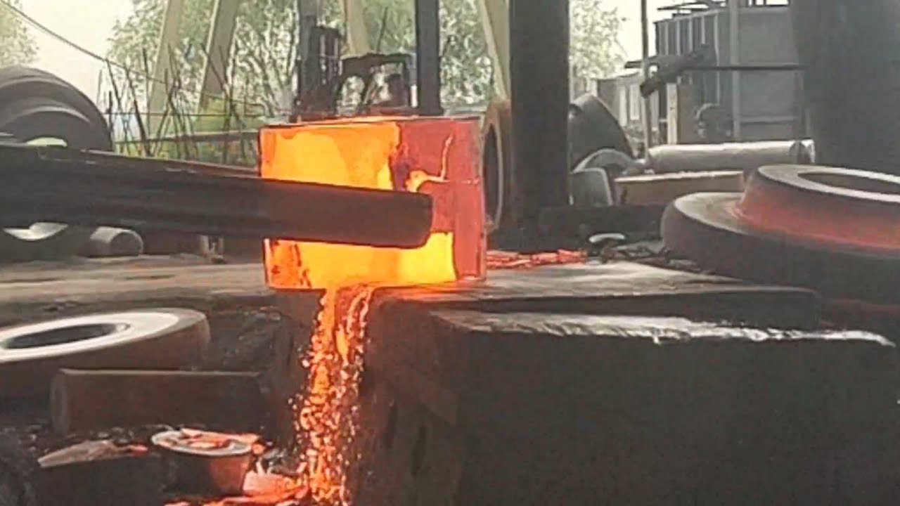 GIANT HEAVY-DUTY EQUIPMENT in Forging Plant - Iron post forging ring ...