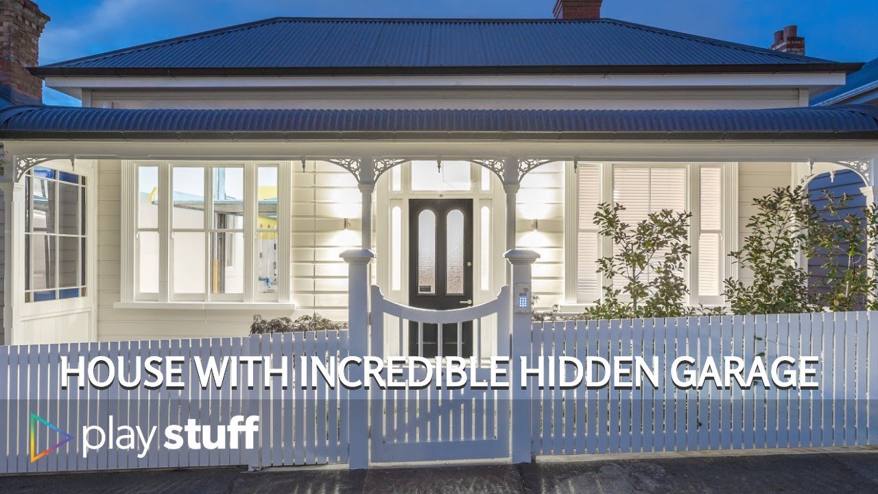 House with amazing secret garage hidden behind traditional front ...