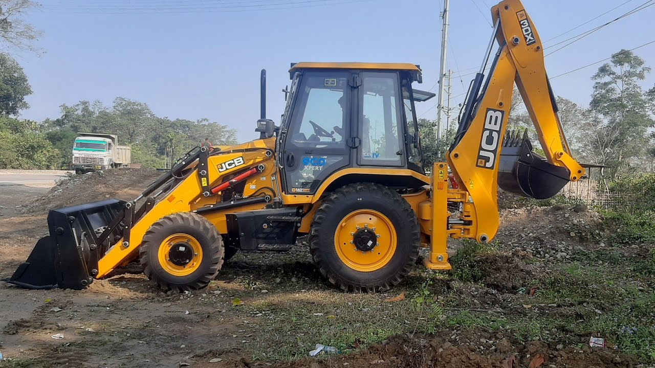 new jcb 3dx super bs4 backhoe unloading from trailer - YouTube