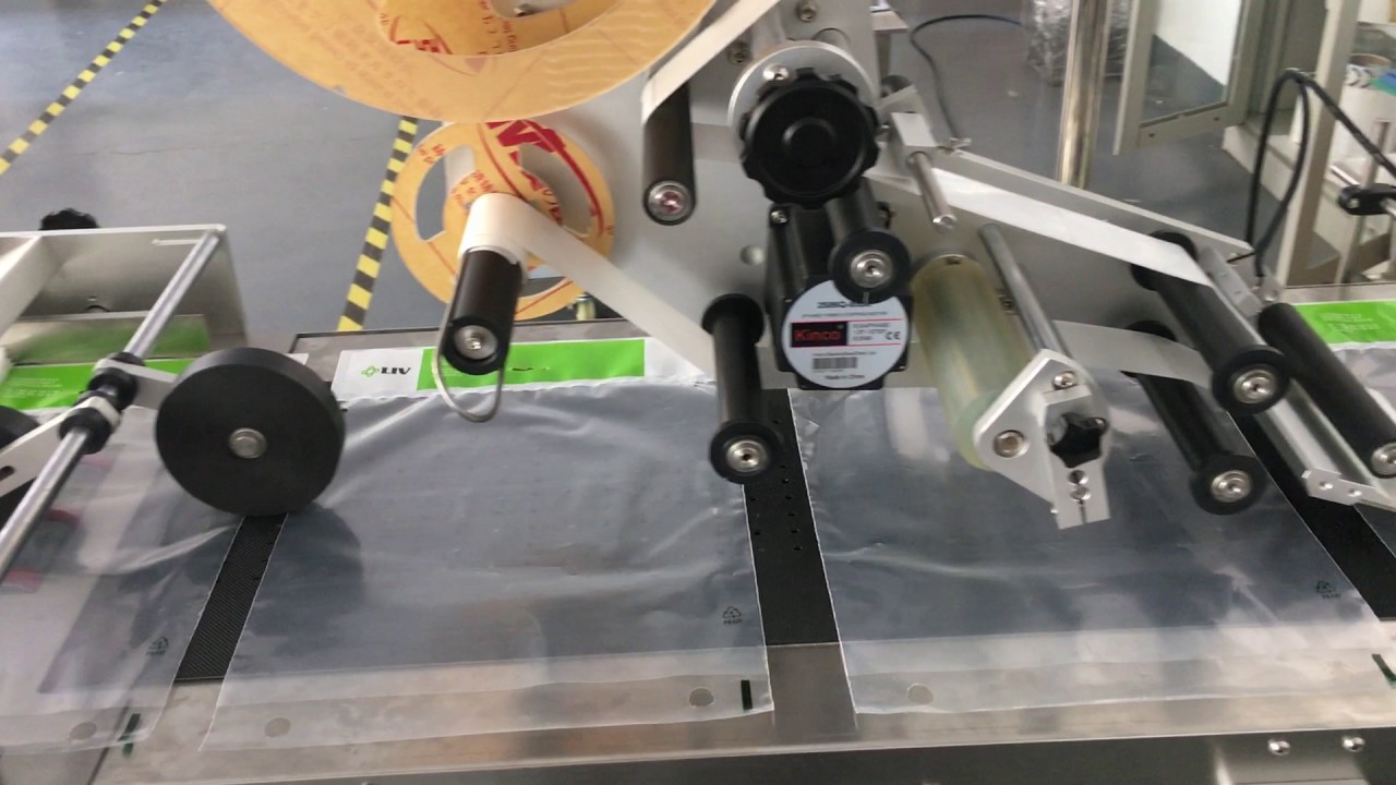 automatic plastic bag labeling machine for Slovenia customer - YouTube