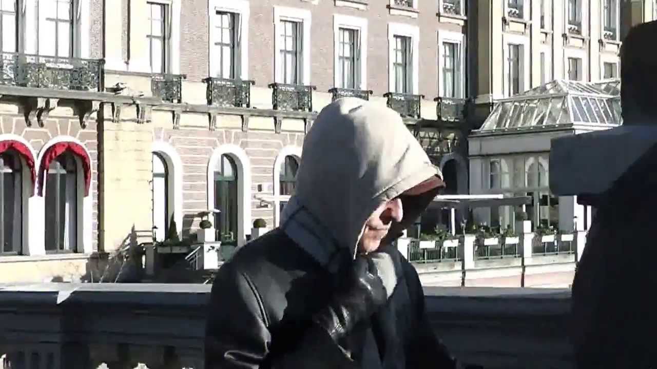 Bob Dylan and bodyguard walk to the bus that takes him to the concert ...