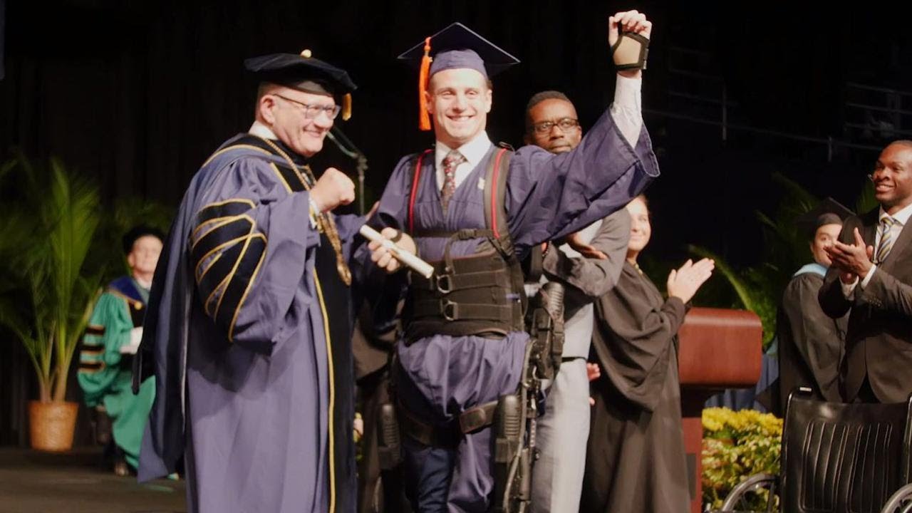 College Graduate Uses Exoskeleton to Walk Across Stage and Accept His ...