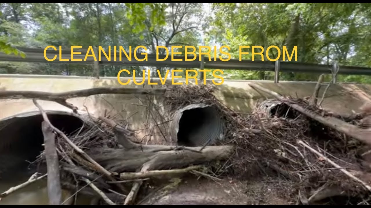 unclogging culverts/debris field cleanup from floods/snake sighting 07/ ...