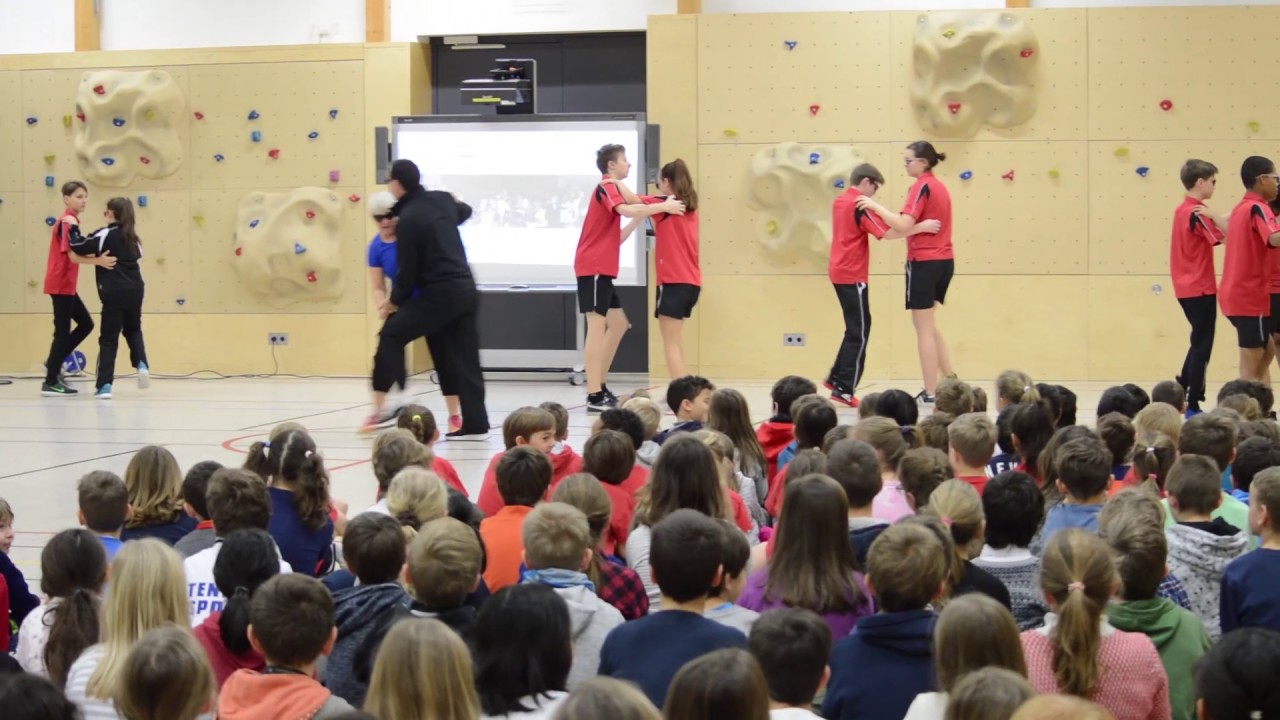 Secondary students dance during Primary Assembly - YouTube