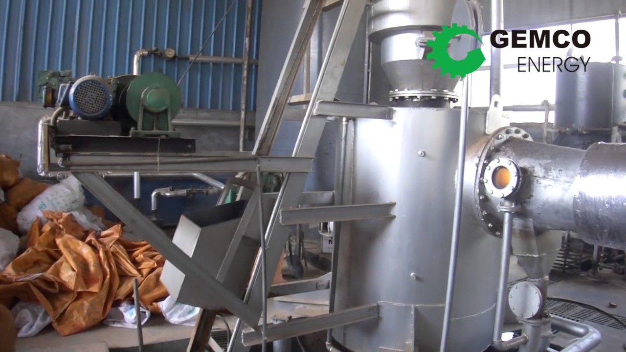 The wood briquettes burning in the biomass boiler - YouTube