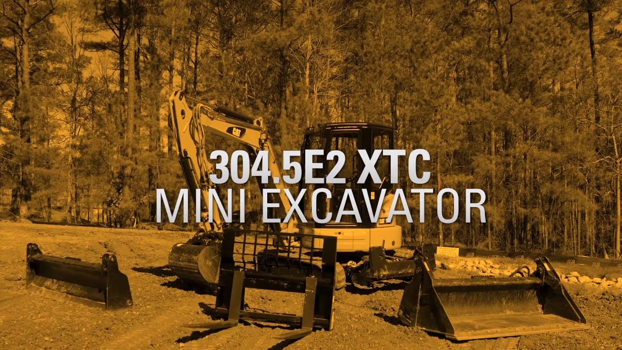 Cat® 304.5E2 XTC Mini Excavator Working with Multi Purpose Bucket - YouTube