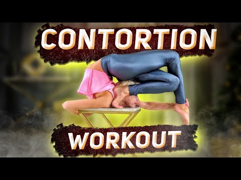 Contortion workout in photostudio. Acrobat Alesya doing backbend stretching.