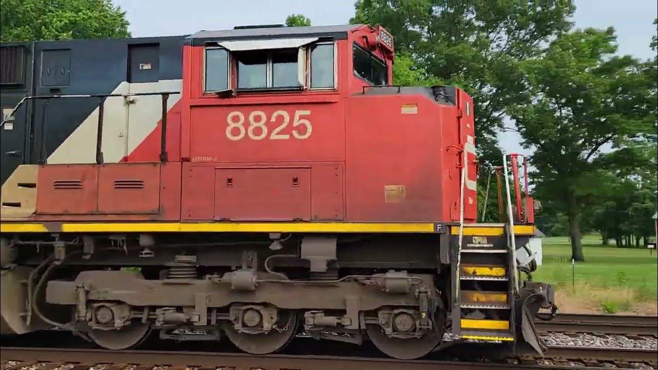 CN 8825 scrapes an Eastbound automobile carrier freight train through Vicksburg, MI - YouTube