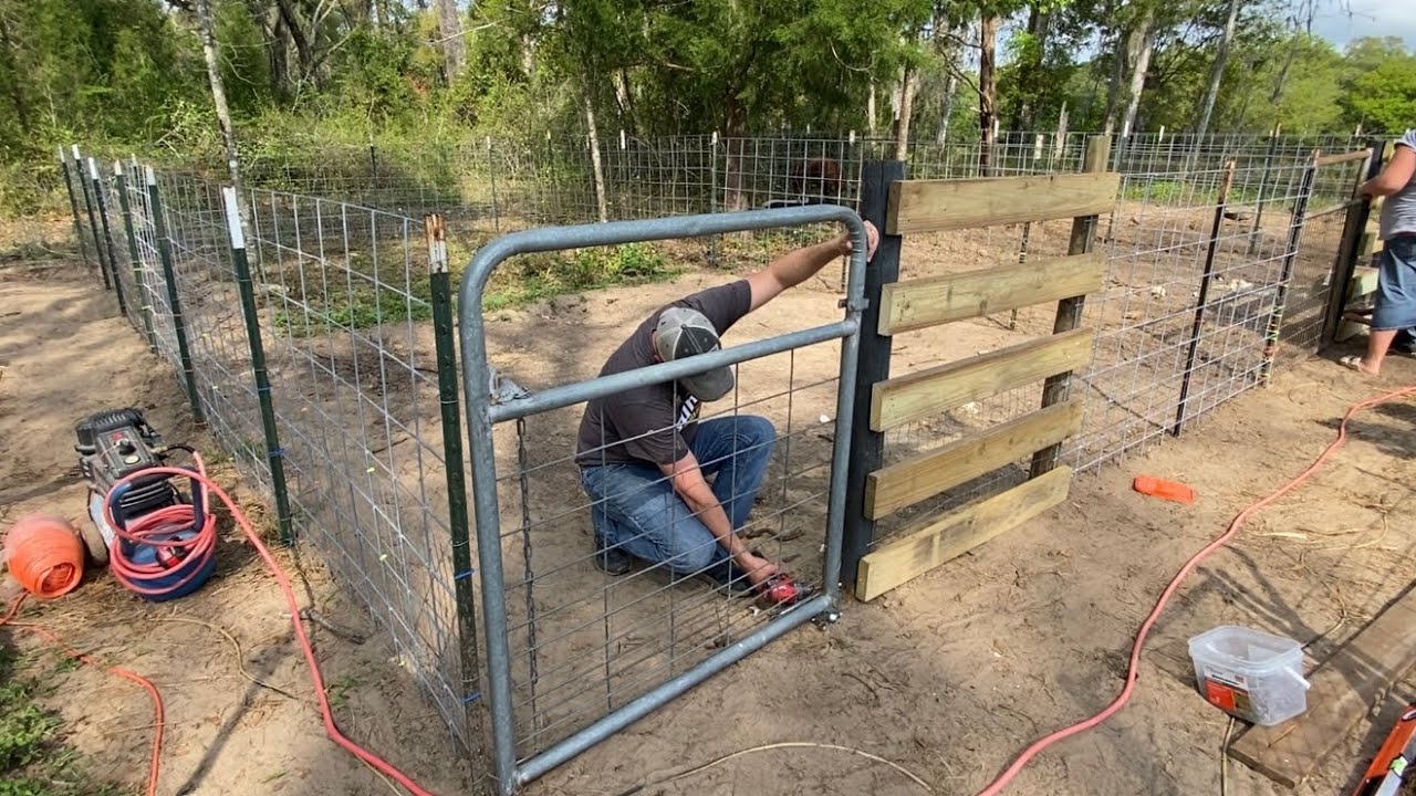 Finishing the new sow farrowing pens, moving a water line. - YouTube