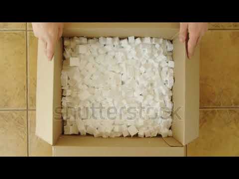 A young man hands opens a parcel contains a gift....