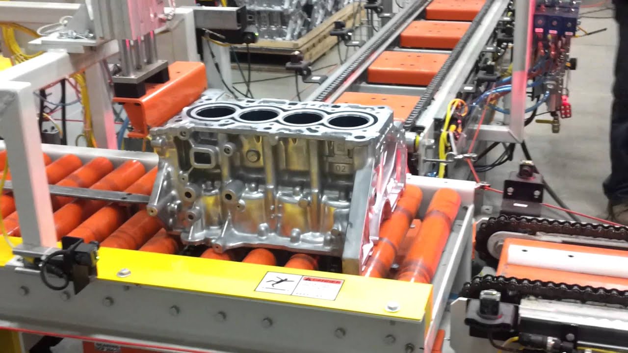 4 cylinder engine block reject transfer conveyor. - YouTube