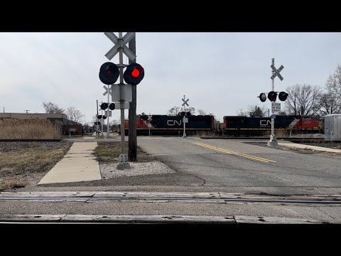 CN 5687 and 2672 Lead CN M385 at St. Johns St. in Wyandotte, MI (3/24 ...