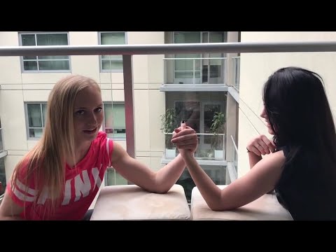 Blonde vs brunette. Female armwrestling.