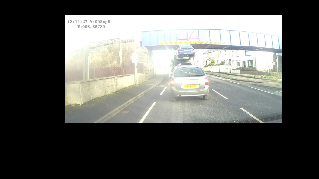Car transporter gets stuck under bridge in Coleraine. - YouTube