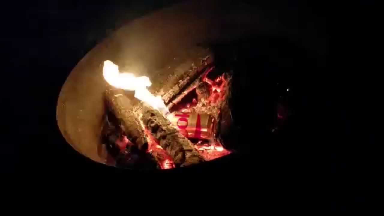 Sodacan filled with bug spray thrown in a campfire - YouTube