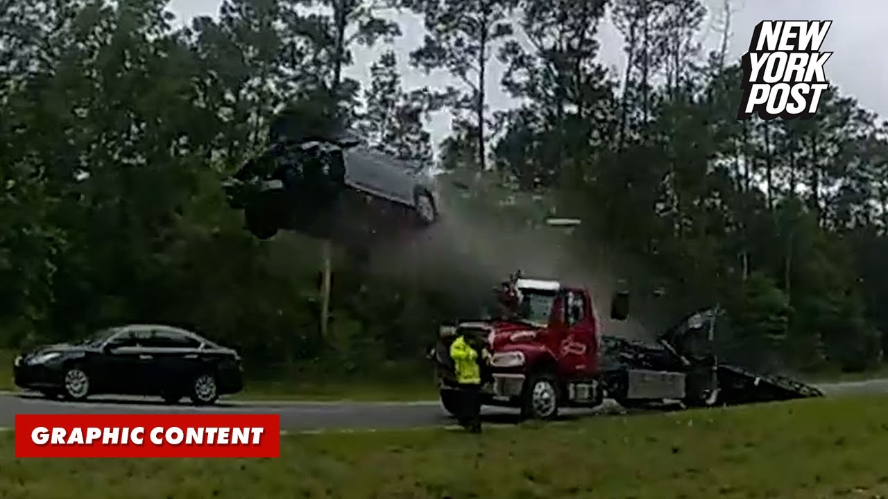 Speeding car flies through the air after launching off tow truck ramp ...