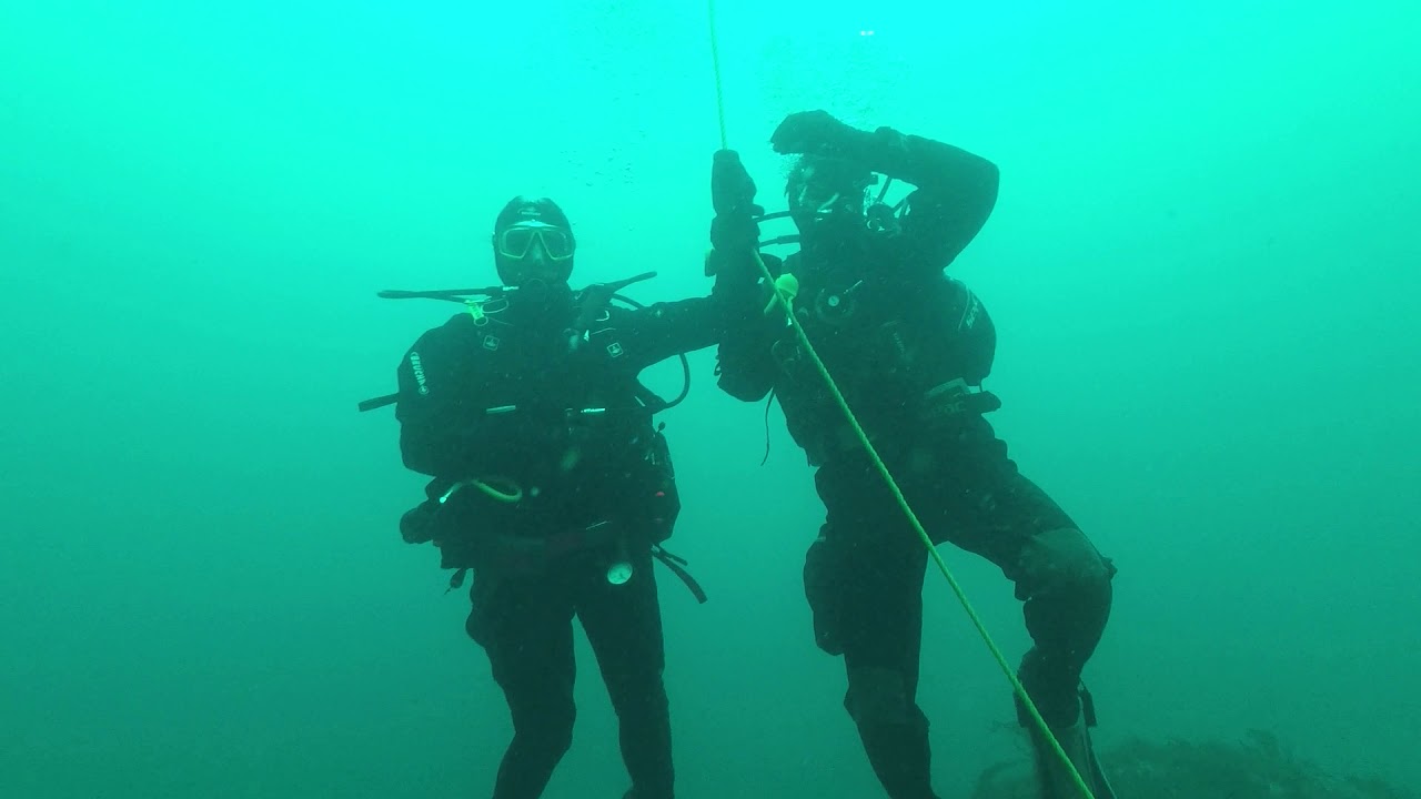 Female diver show buddy how to dive to huge shipwreck in Nordic Sea ...