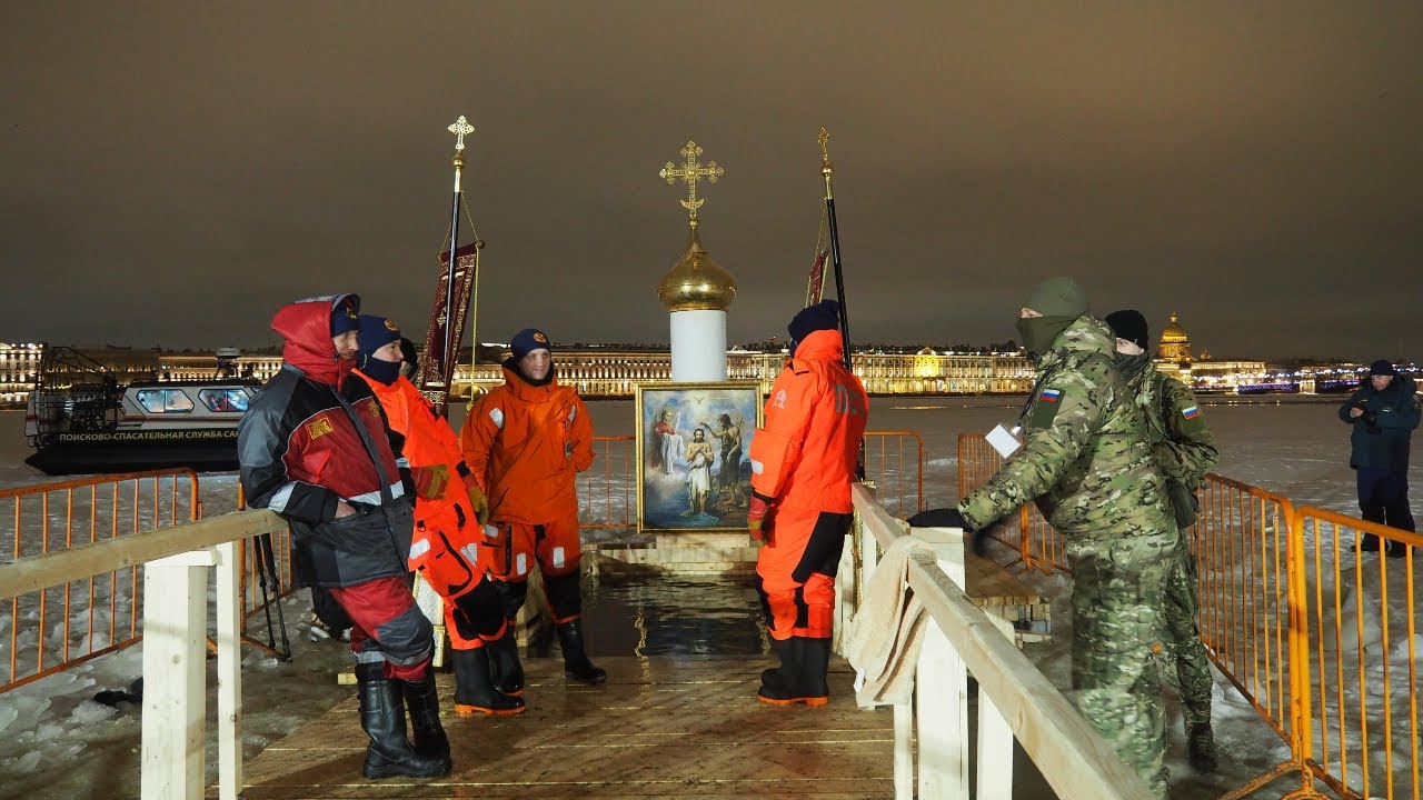 Plunging in ice cold water. A religious ceremony in Russia. Baptism of ...
