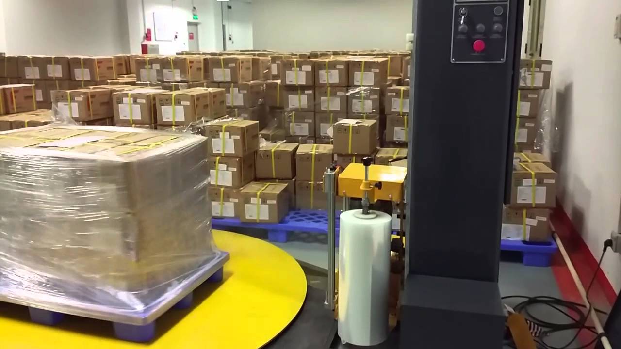 Automatic clamp and cut system pallet wrapping machine - YouTube