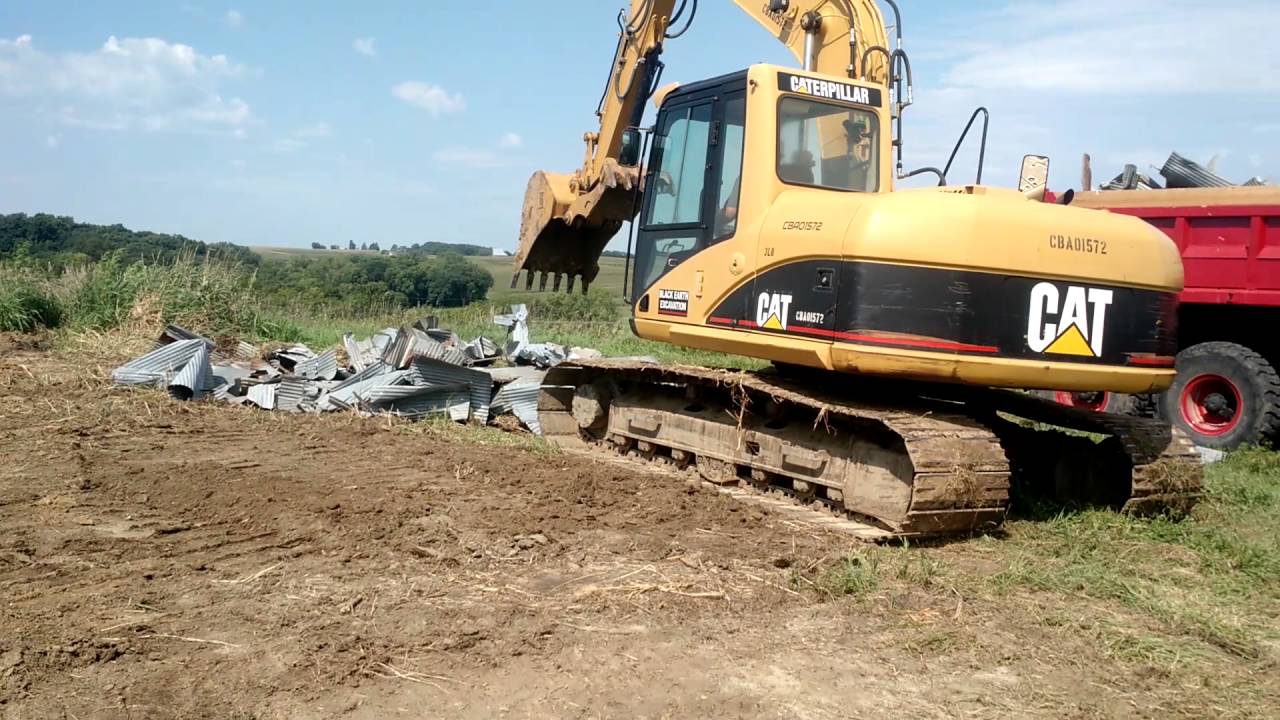 Loading scrap tin, hay barn demo - YouTube
