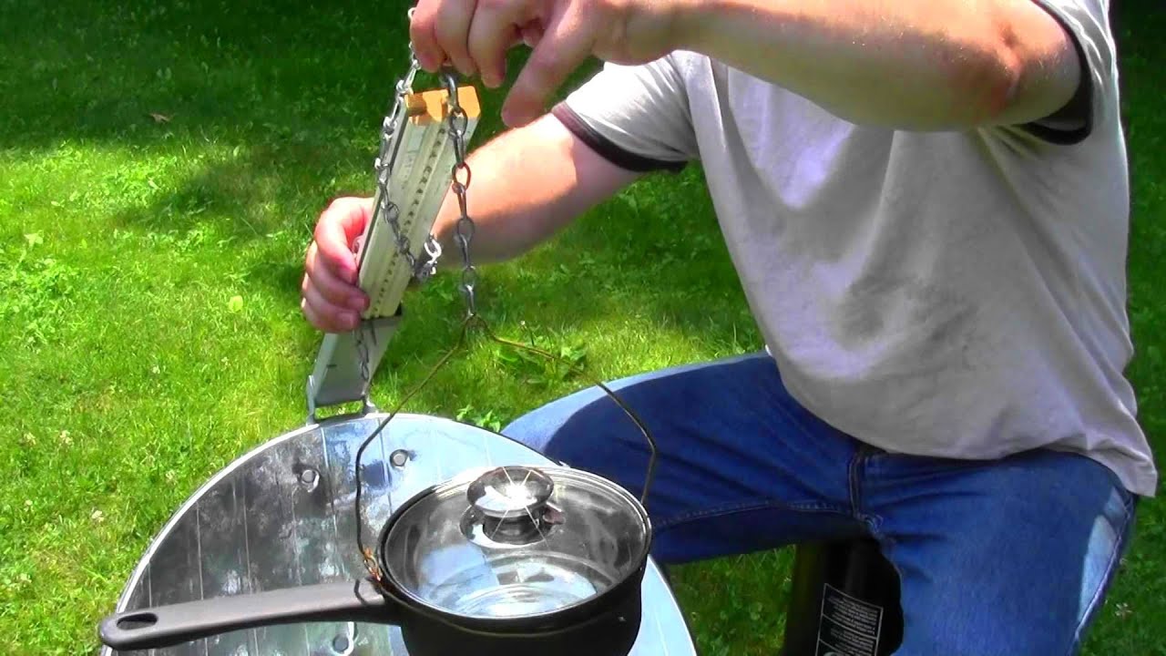 Satellite dish solar cooker - cooking a hamburger. - YouTube