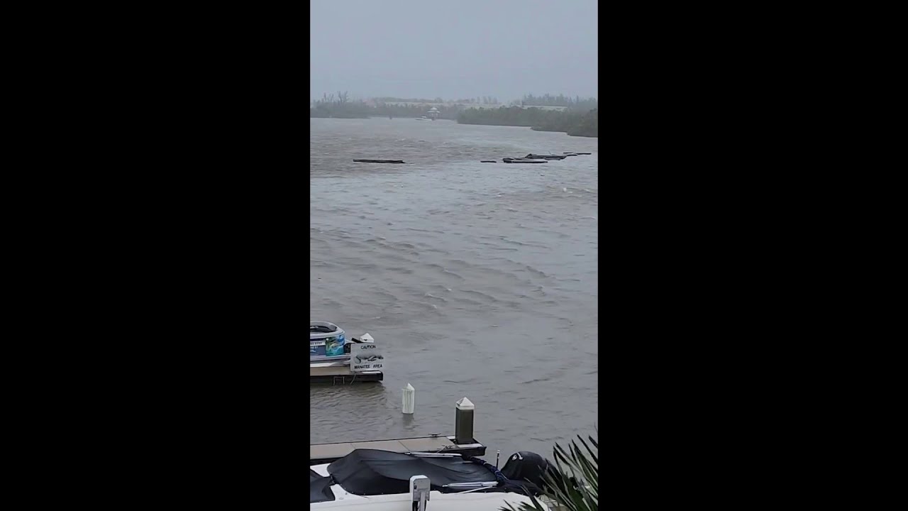 Debris flows through flooded area of Naples as Hurricane Ian moves over ...