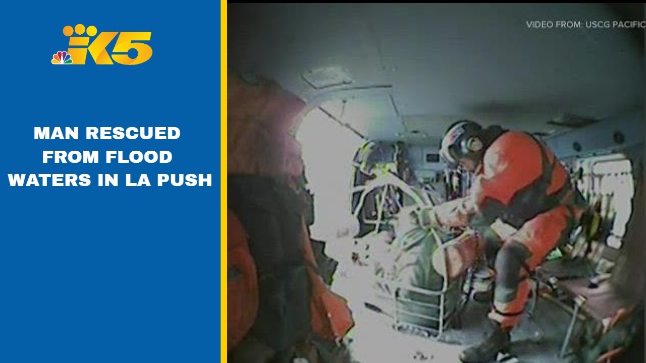 Man rescued after spending 12 hours trapped by flood waters - YouTube