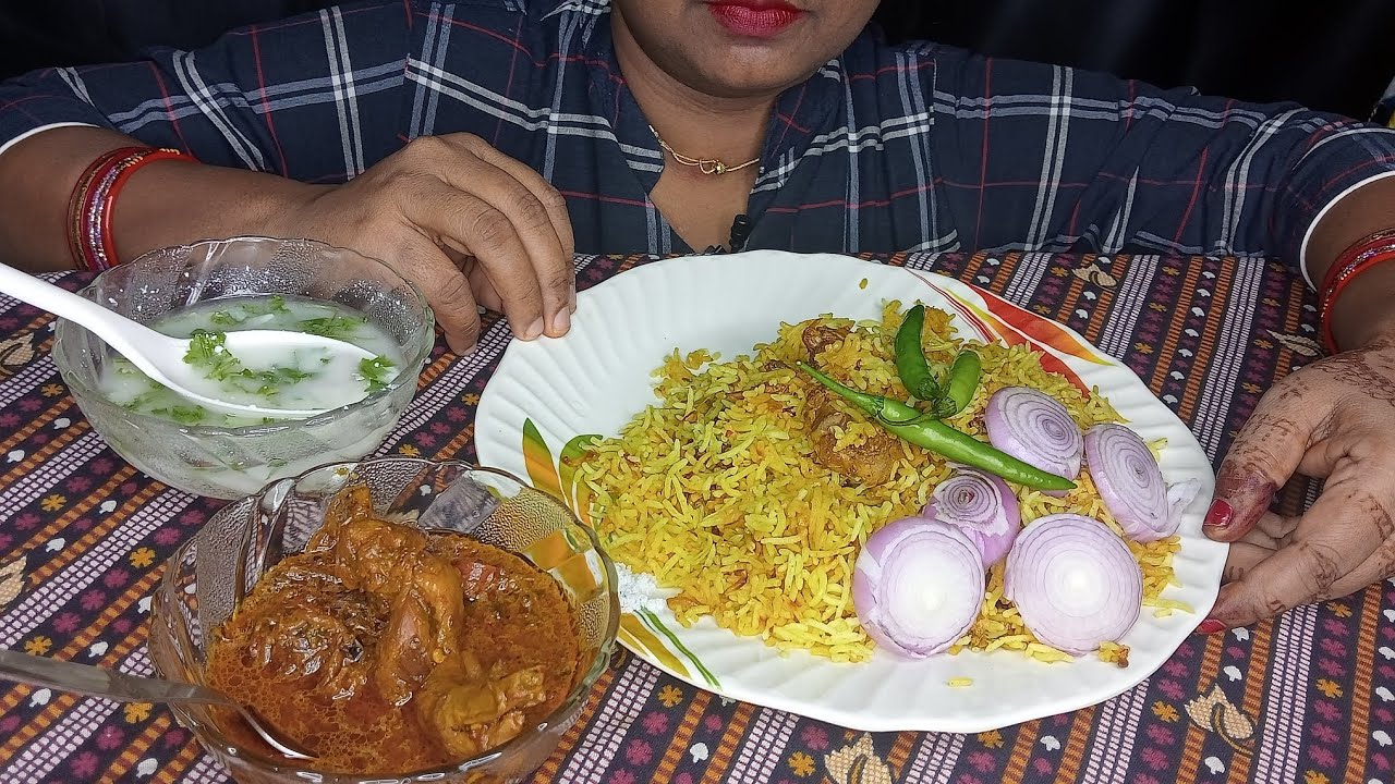food eating show eating chicken biryani with chicken curry raita and ...