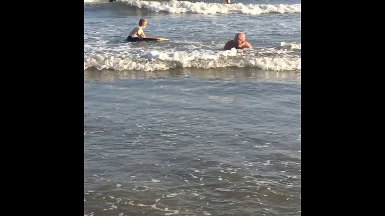 Oscar & Daddy surfing on Highcliffe Beach - YouTube