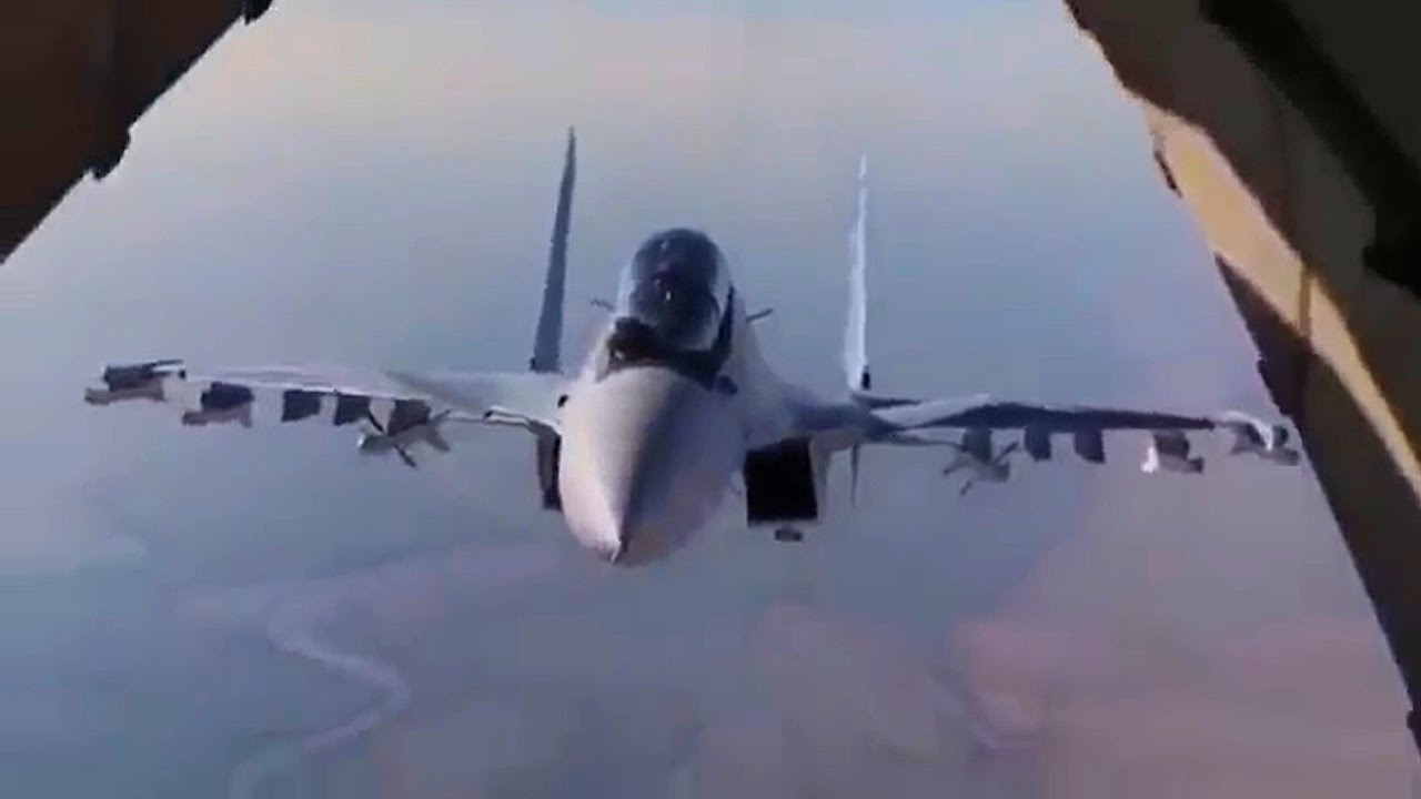 Fighter Jet Flies Behind Cargo Plane - YouTube