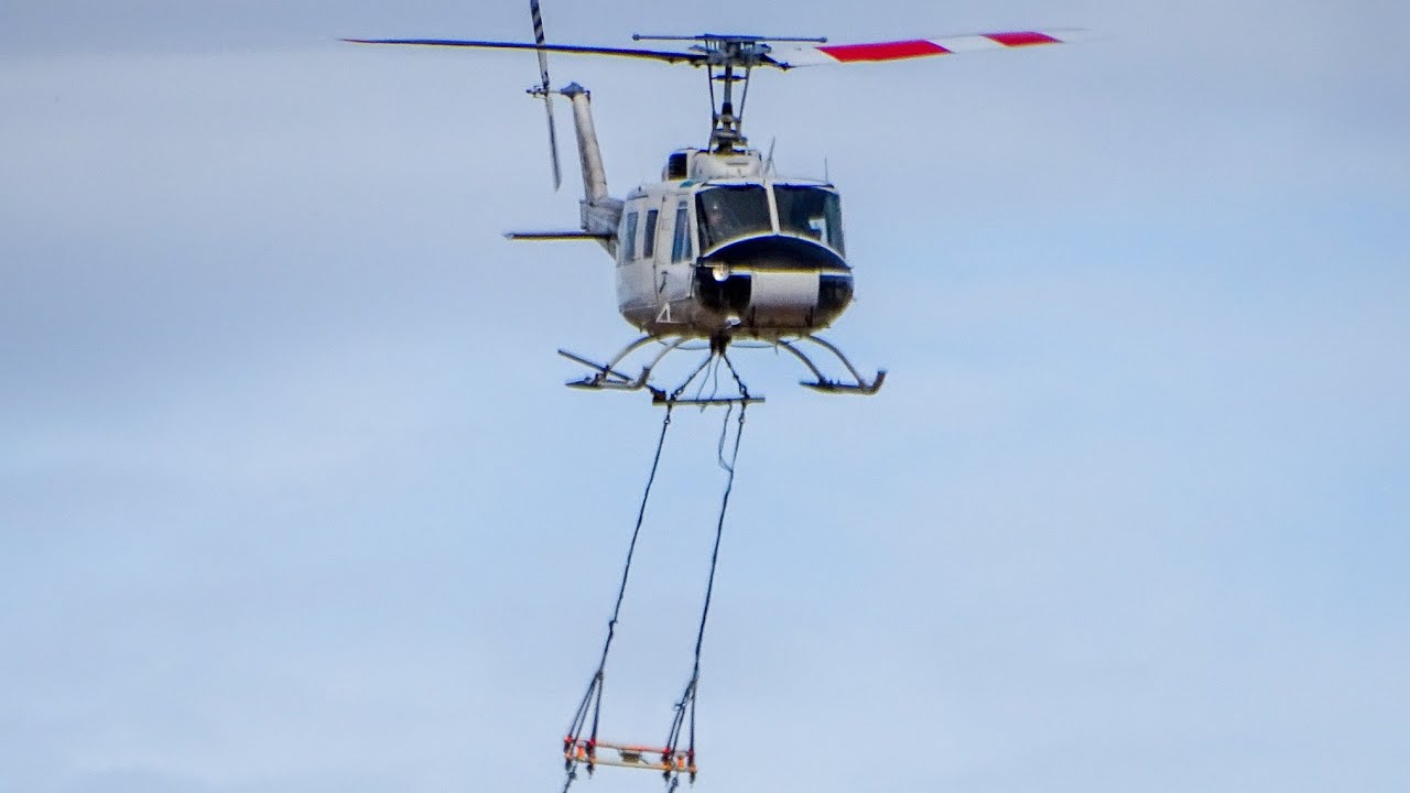 Heli-lift Services Bell 205A-1 Working A Remote Site - YouTube