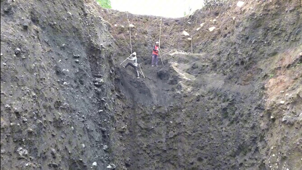 risky work digging sand on high cliffs - YouTube