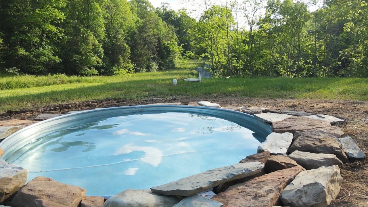 E36 - Stock tank pool heated by fire - YouTube