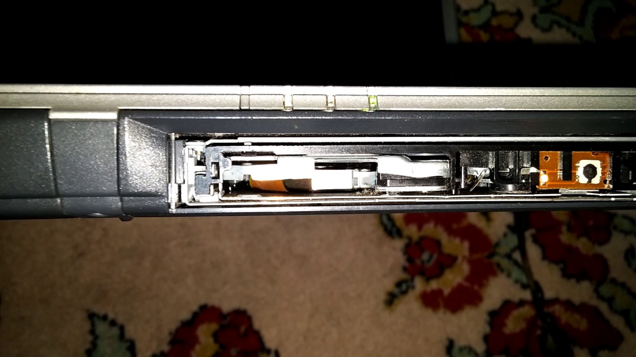 Inside a functioning laptop CD/DVD drive - YouTube