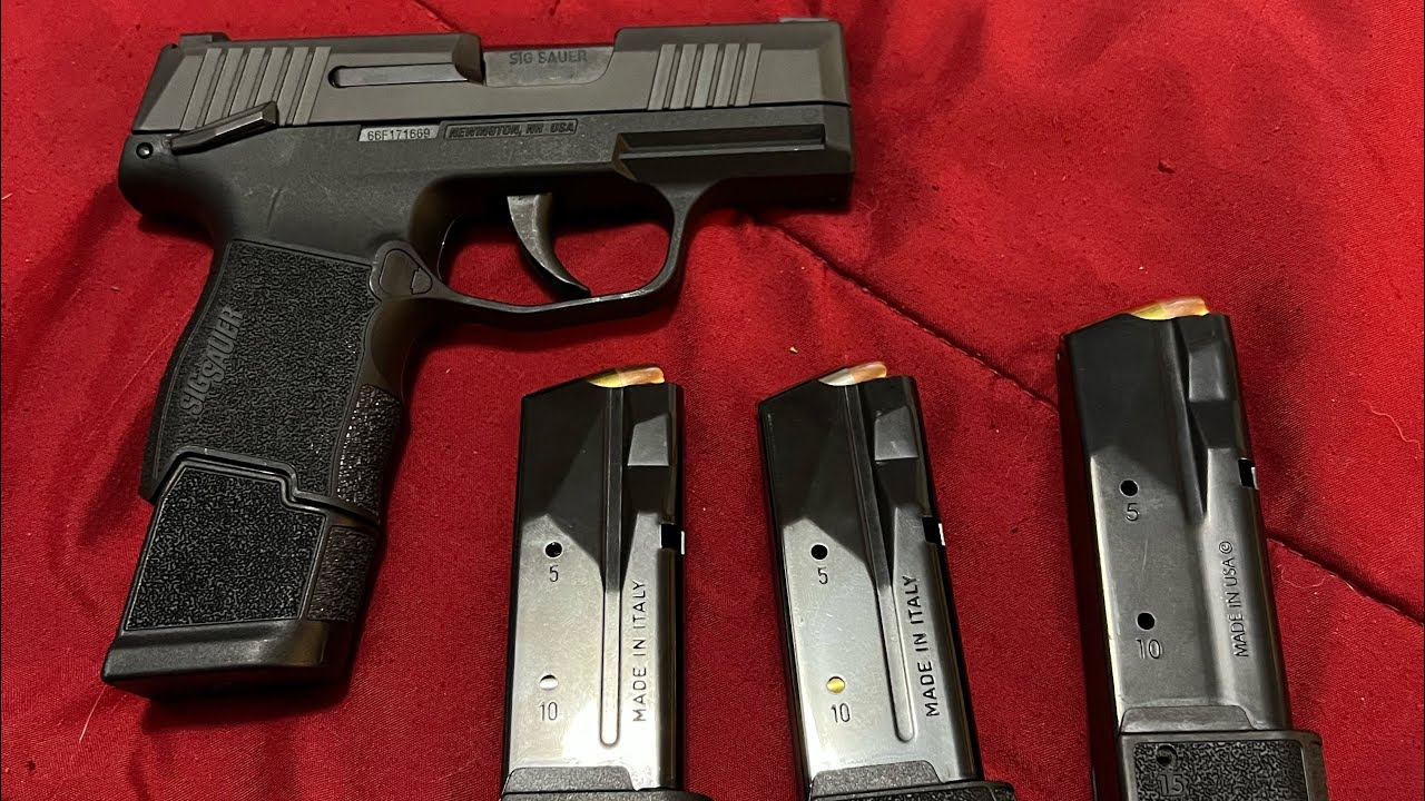 Sig Sauer P365 with a 17 round Macro magazine and 15 round magazine ...