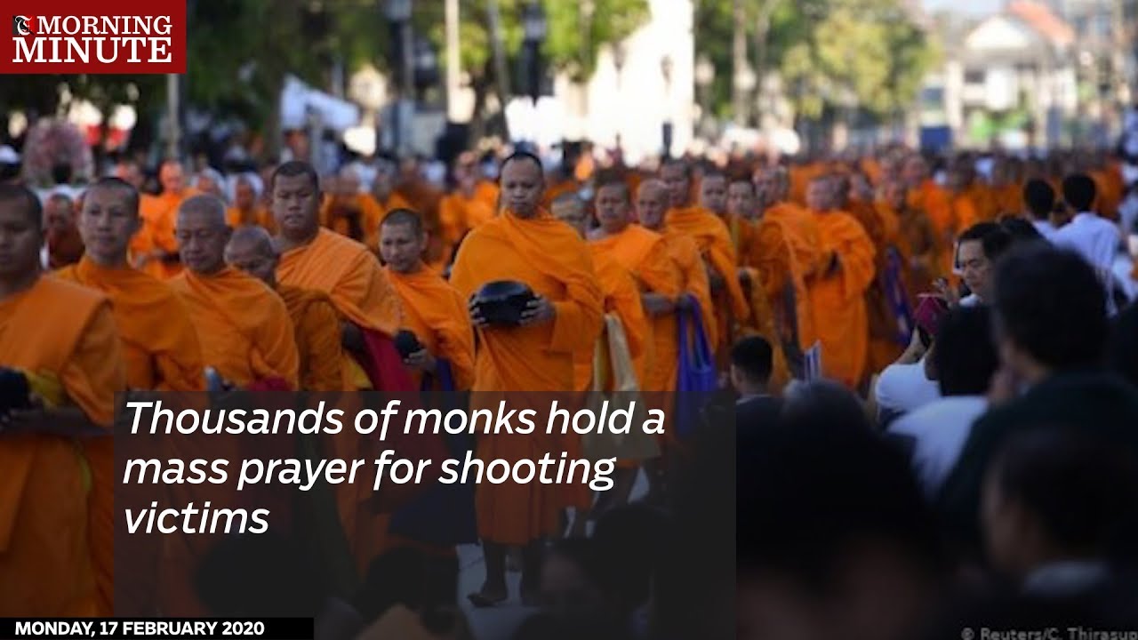 Thousands of monks hold a mass prayer for shooting victims - YouTube