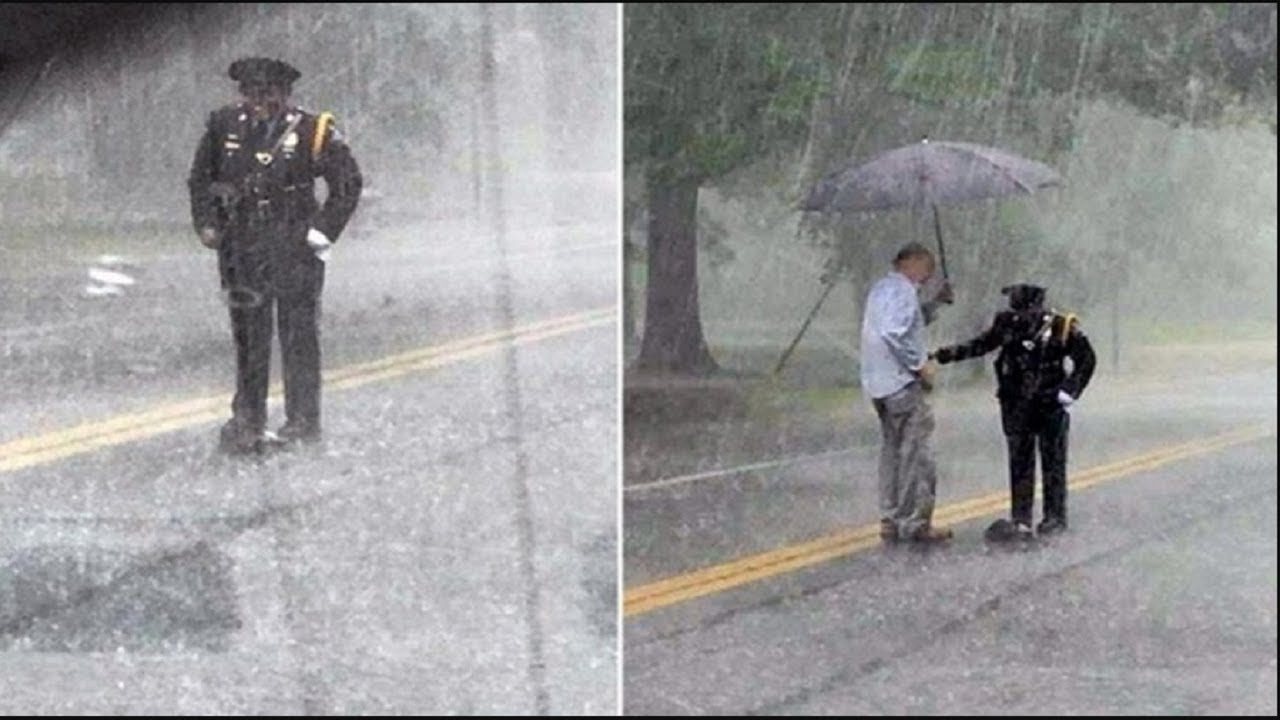Cop Stands in the Rain During a Storm Until a Couple Drives by and ...