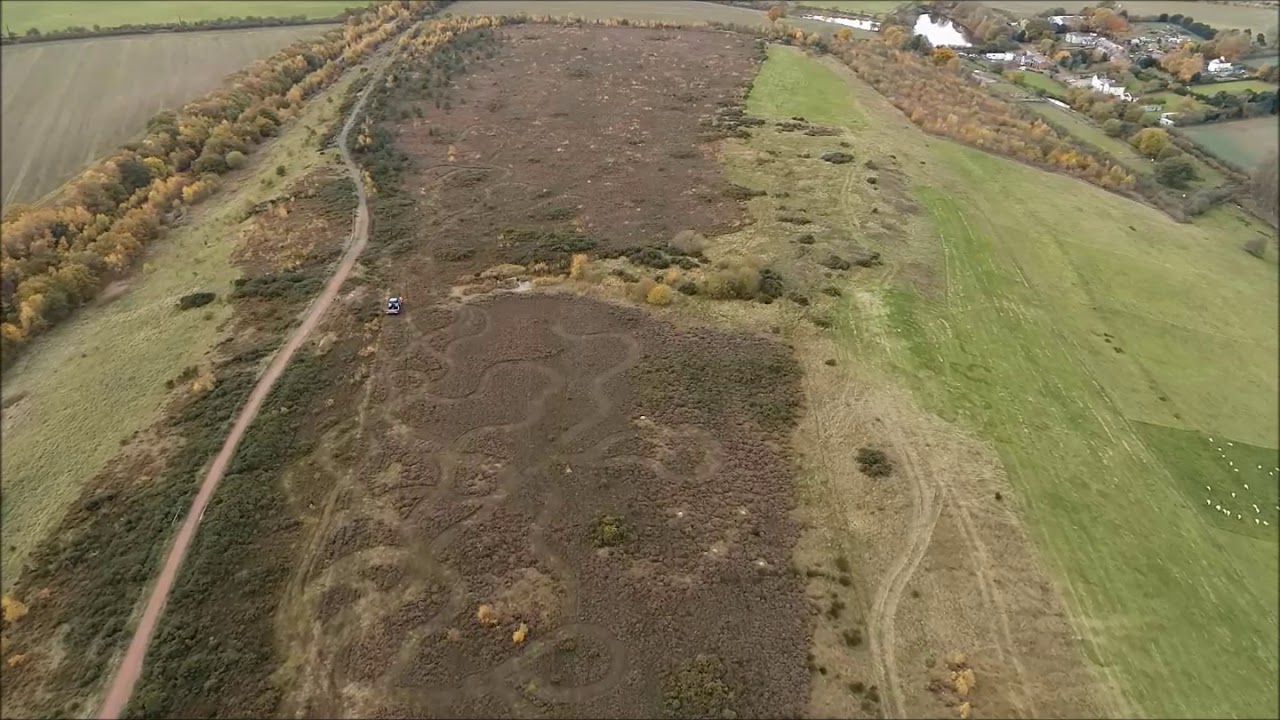 Heather brash cutting and spreading - YouTube