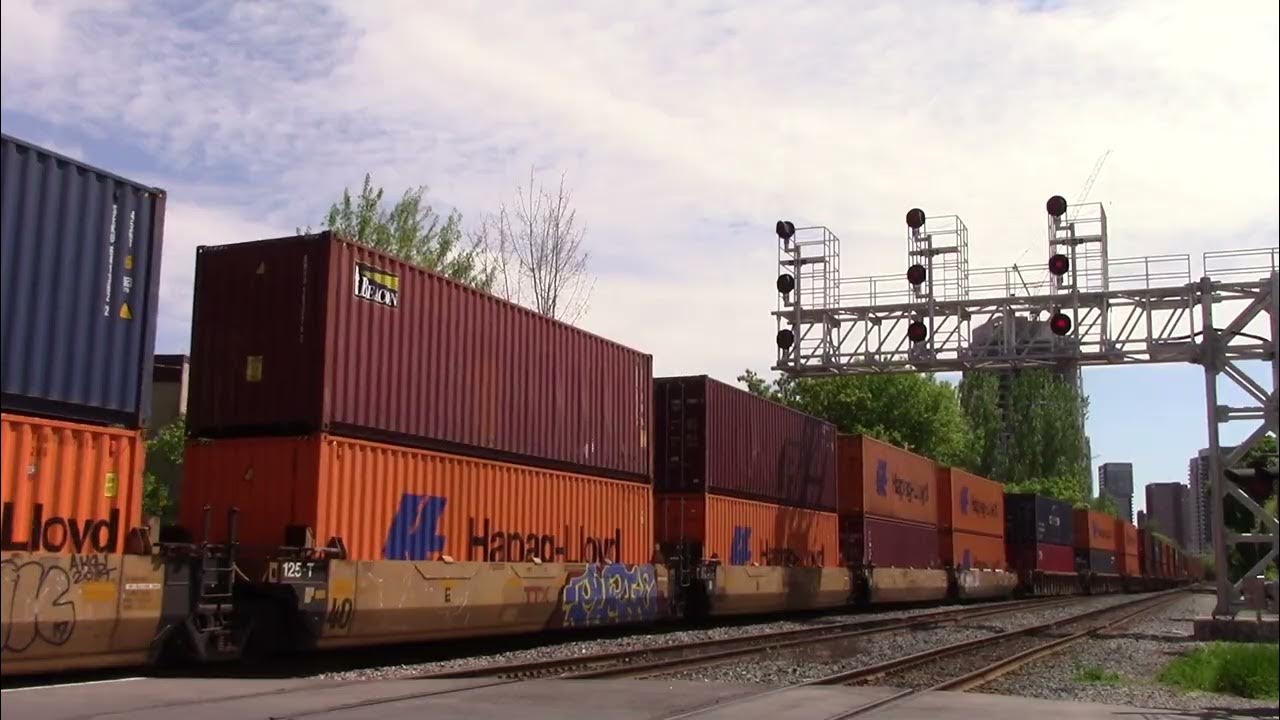 (CPKC) CP 113 with KCS 4696 mid DPU passing Osler - YouTube