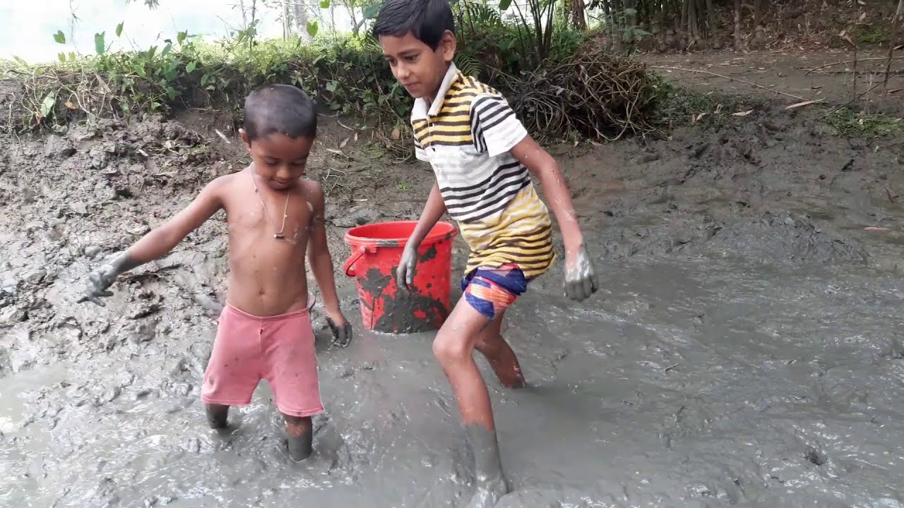 Traditional Best Hand Fishing - smart boy catching fish from mud water ...